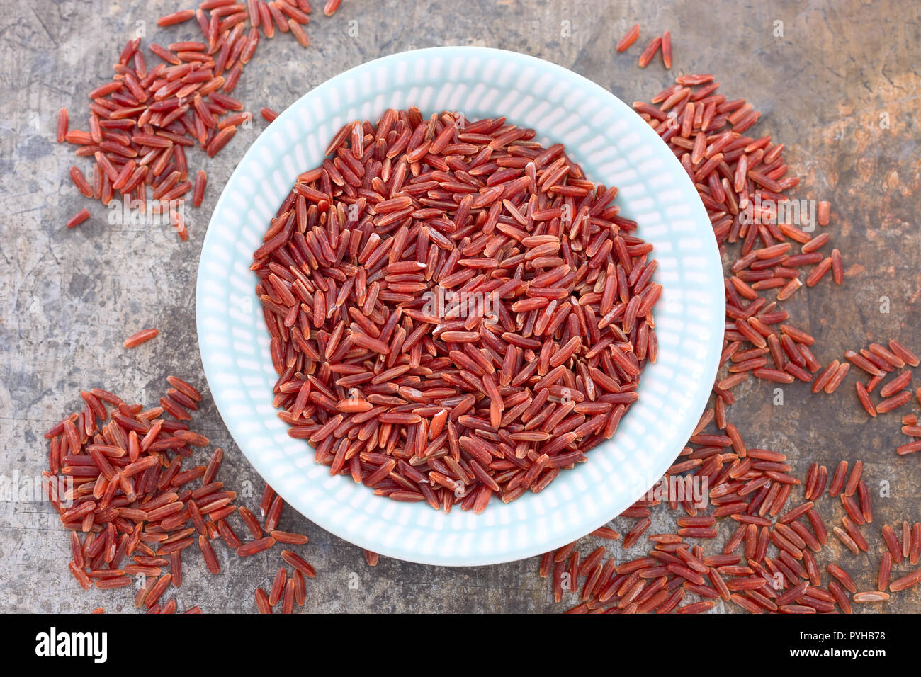 Raw red rice Stock Photo - Alamy