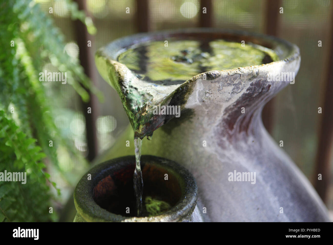 Outdoor water feature with running water Stock Photo - Alamy