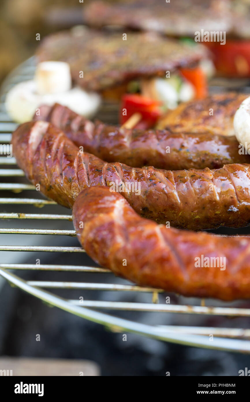barbecue with delicious grilled meat and vegetables on grill Stock ...