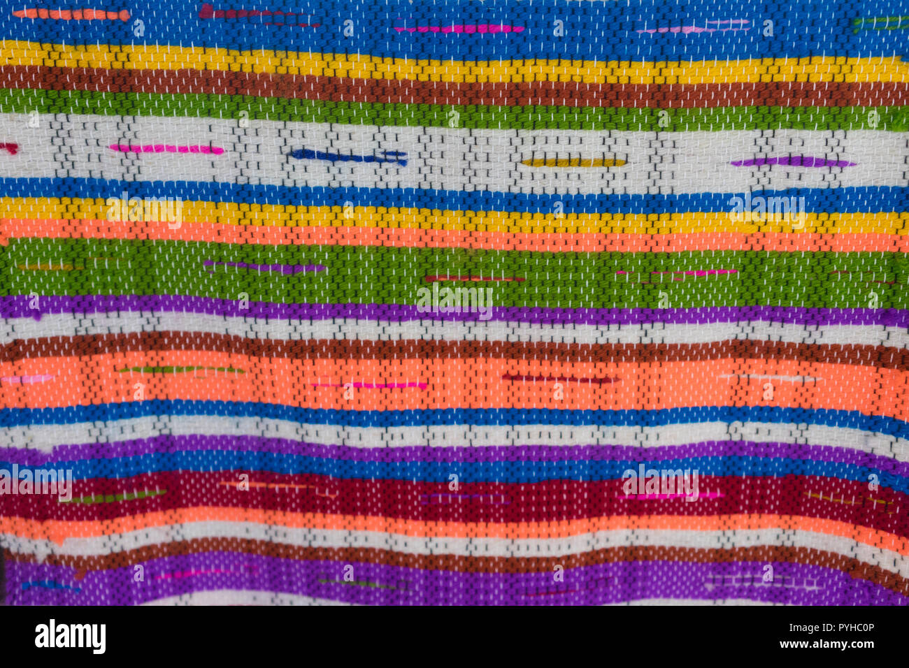 bright background with woven surface handmade and colourful textile ...