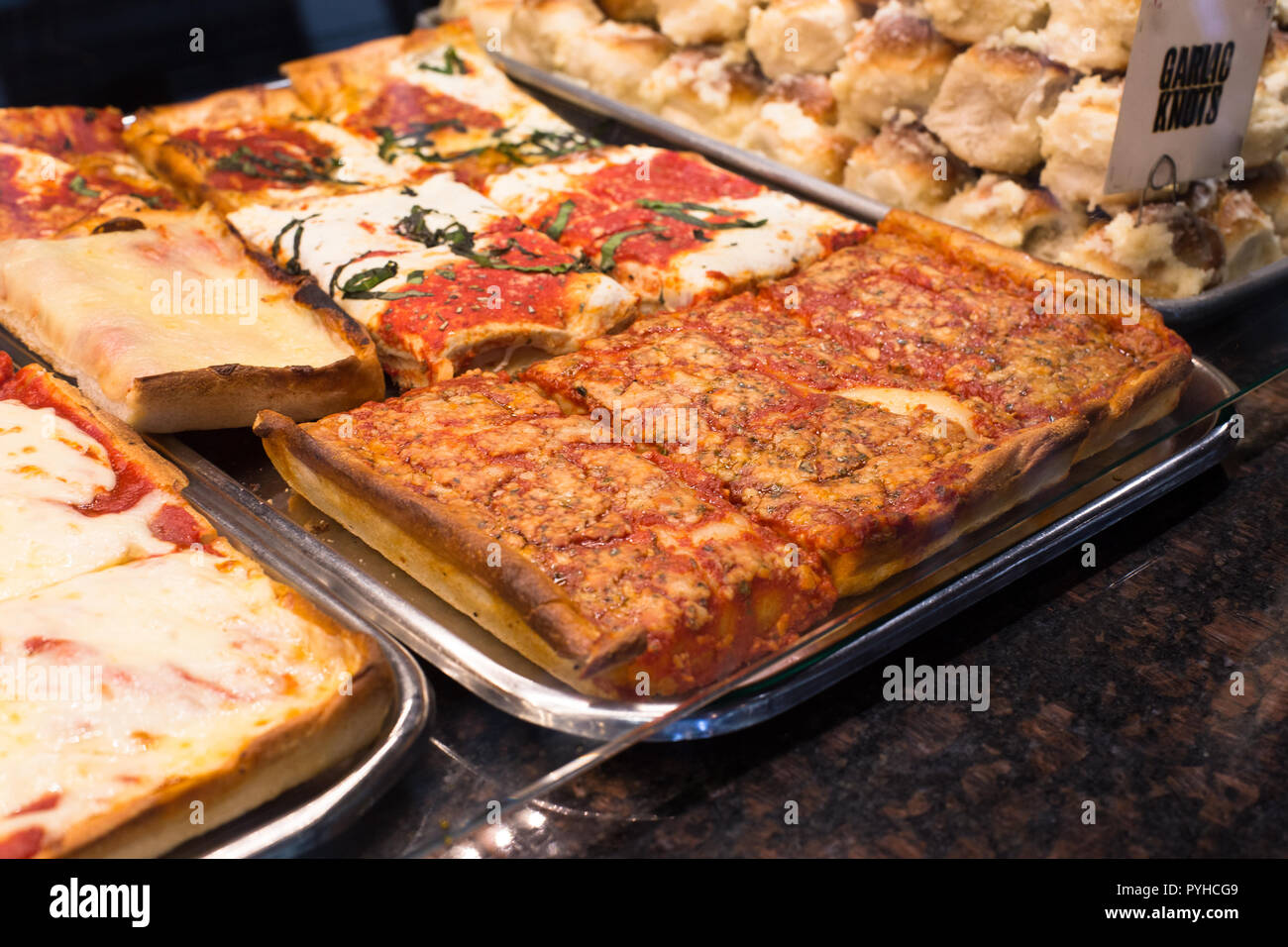 Authentic Italian New York City style pizza in window display Stock ...