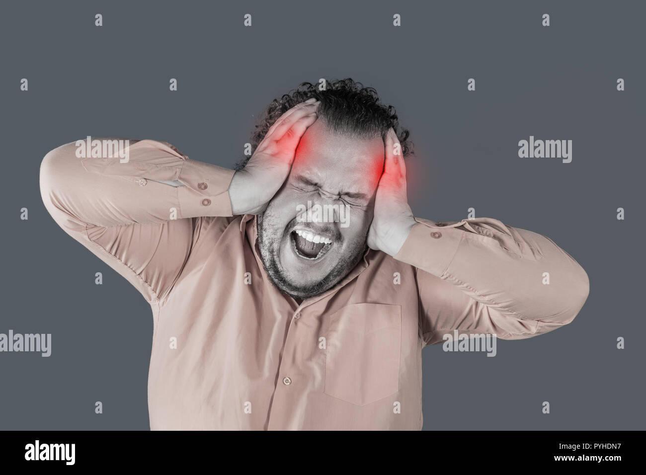 A fat man has high blood pressure and headache Stock Photo - Alamy