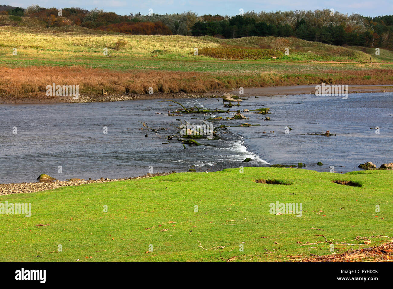 A very old wooden weir now in a state of decay maintaining high water ...