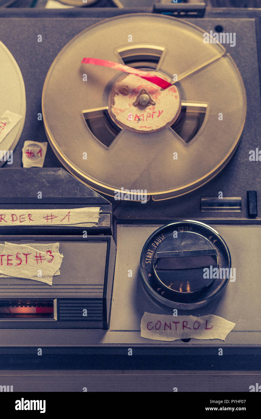 Old reel audio recorder with a few rolls of tape Stock Photo - Alamy