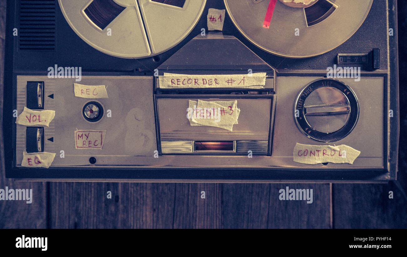 Old reel audio recorder with microphone and roll of tape Stock Photo ...