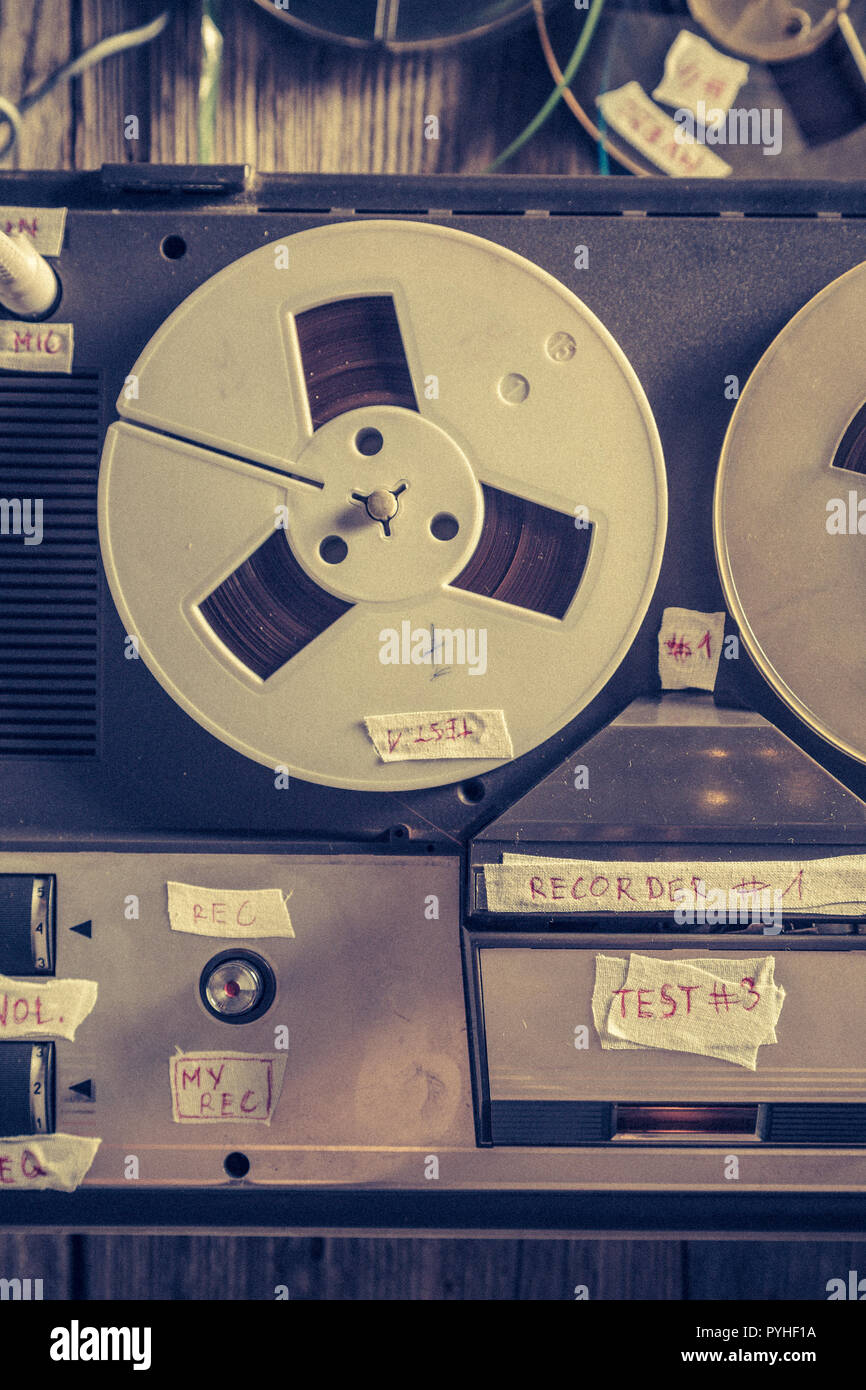 Retro audio tape recorder with a few rolls of tape Stock Photo - Alamy