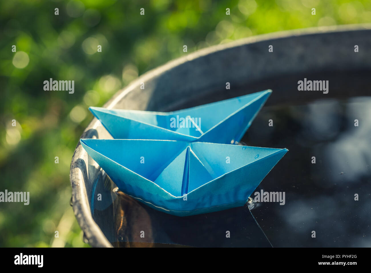 Handmade paper boats as toned and filtered photo Stock Photo - Alamy