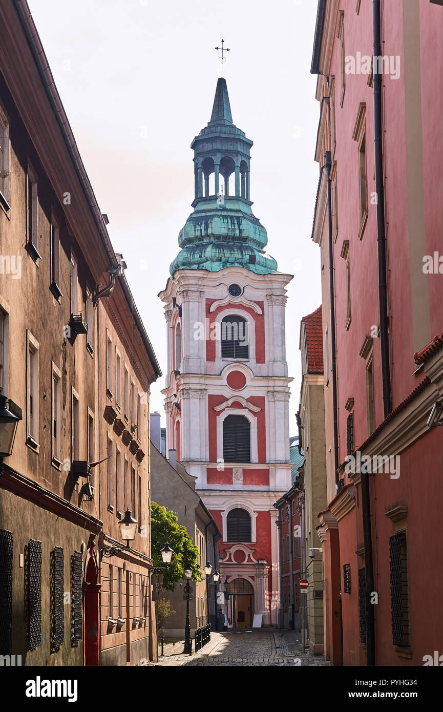 Baroque monastery tower and a cobbled street in Poznan Stock Photo - Alamy