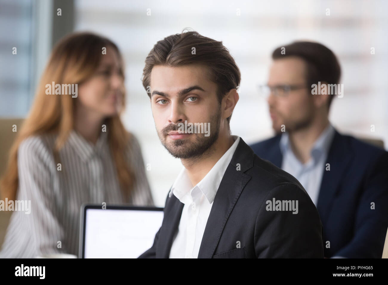 Head shot portrait of confident businessman at workplace Stock Photo ...