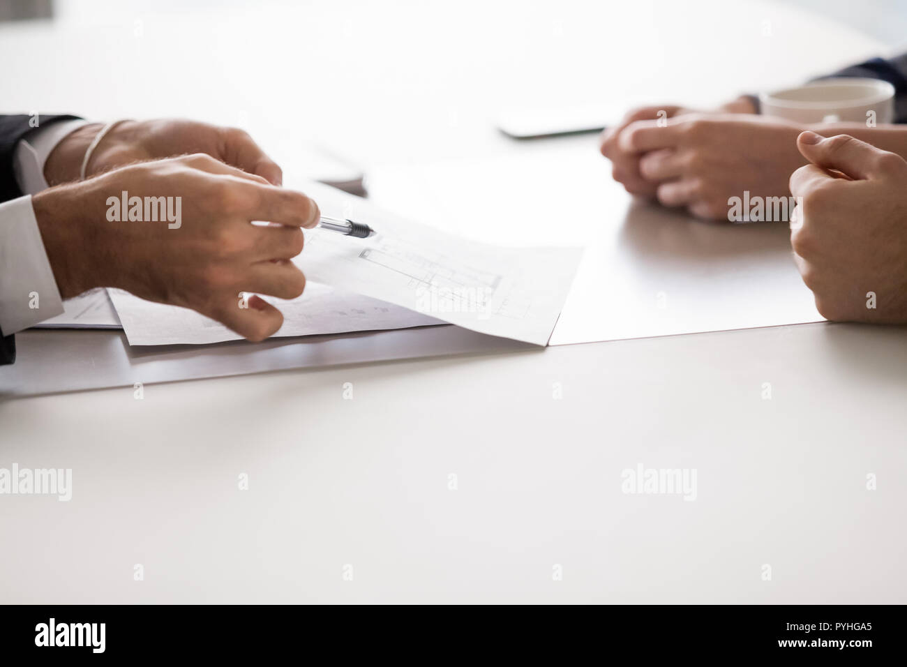 Signing contract, man indicates where to put signature Stock Photo - Alamy