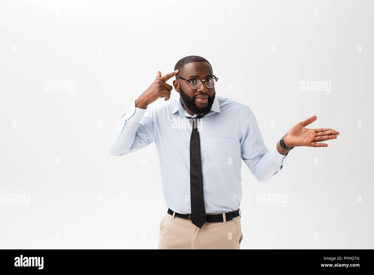 Portrait of angry or annoyed young African American man in white polo ...