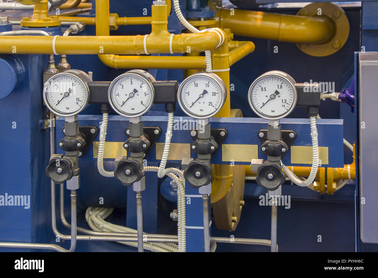 System's cooper pipes with Four manometers with valves Stock Photo - Alamy