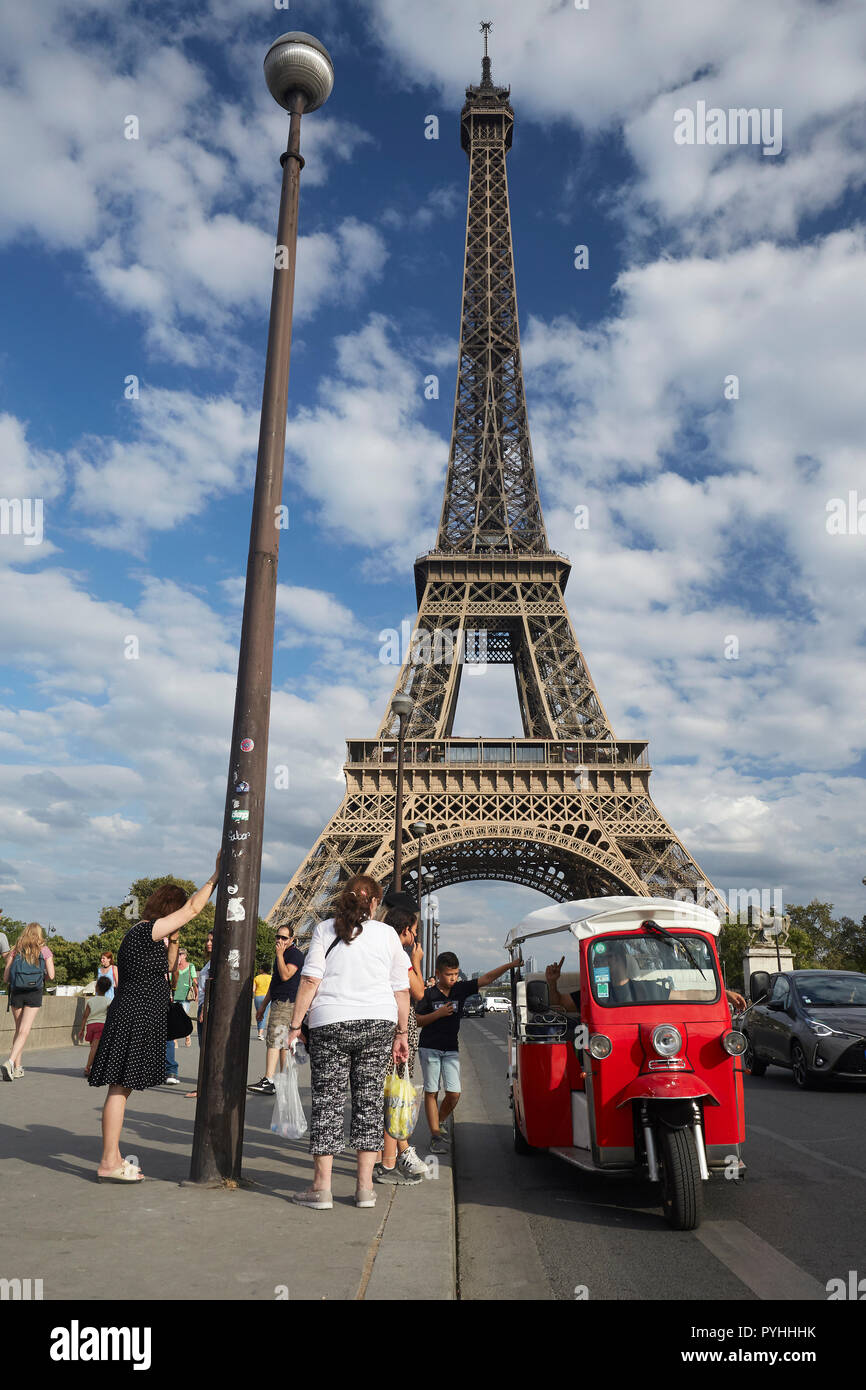 Paris, Ile-de-France, France - tourists stand at an autorickshaw on the ...