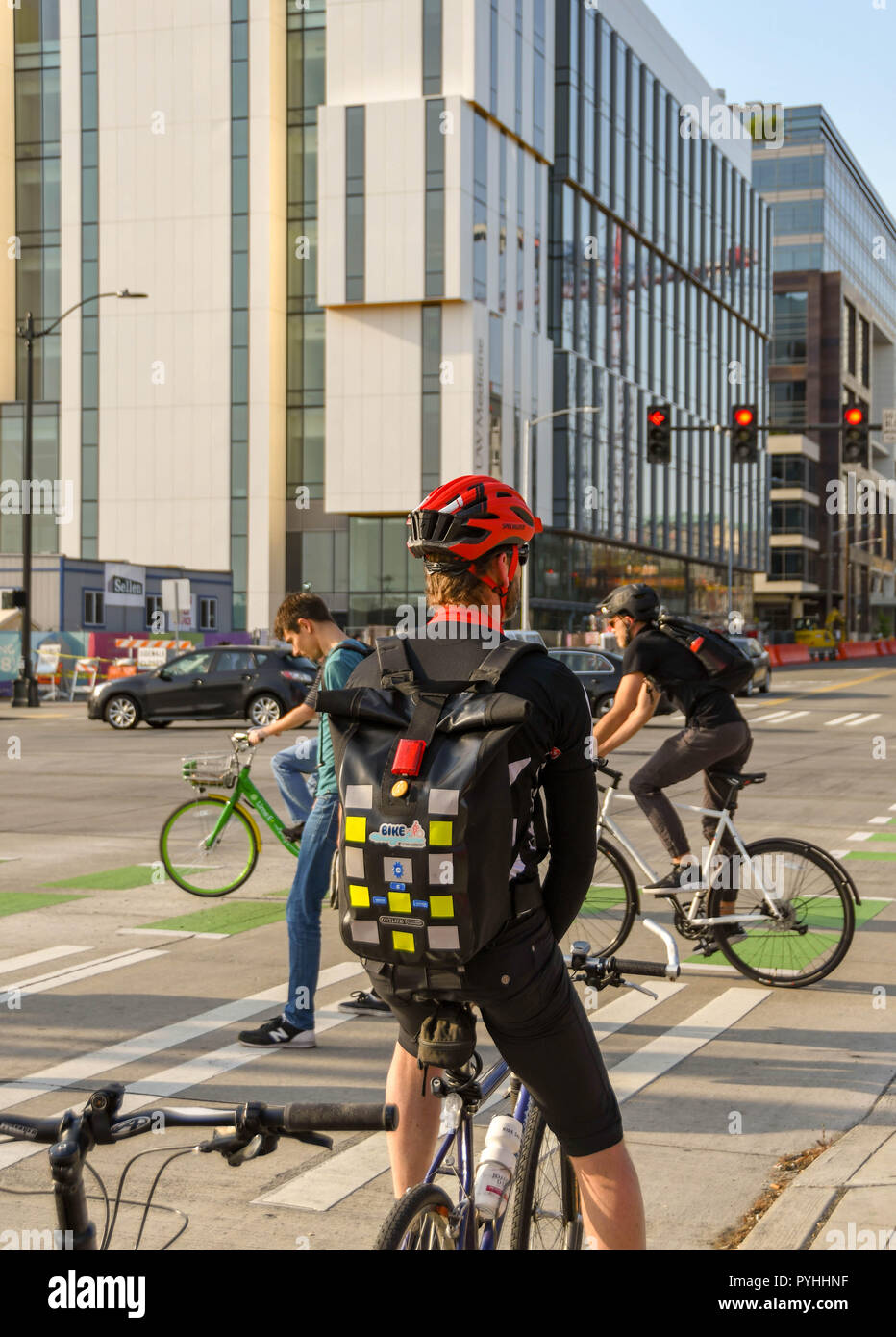 SEATTLE, WASHINGTON STATE, USA - JUNE 2018: Cyclist commuting to work ...