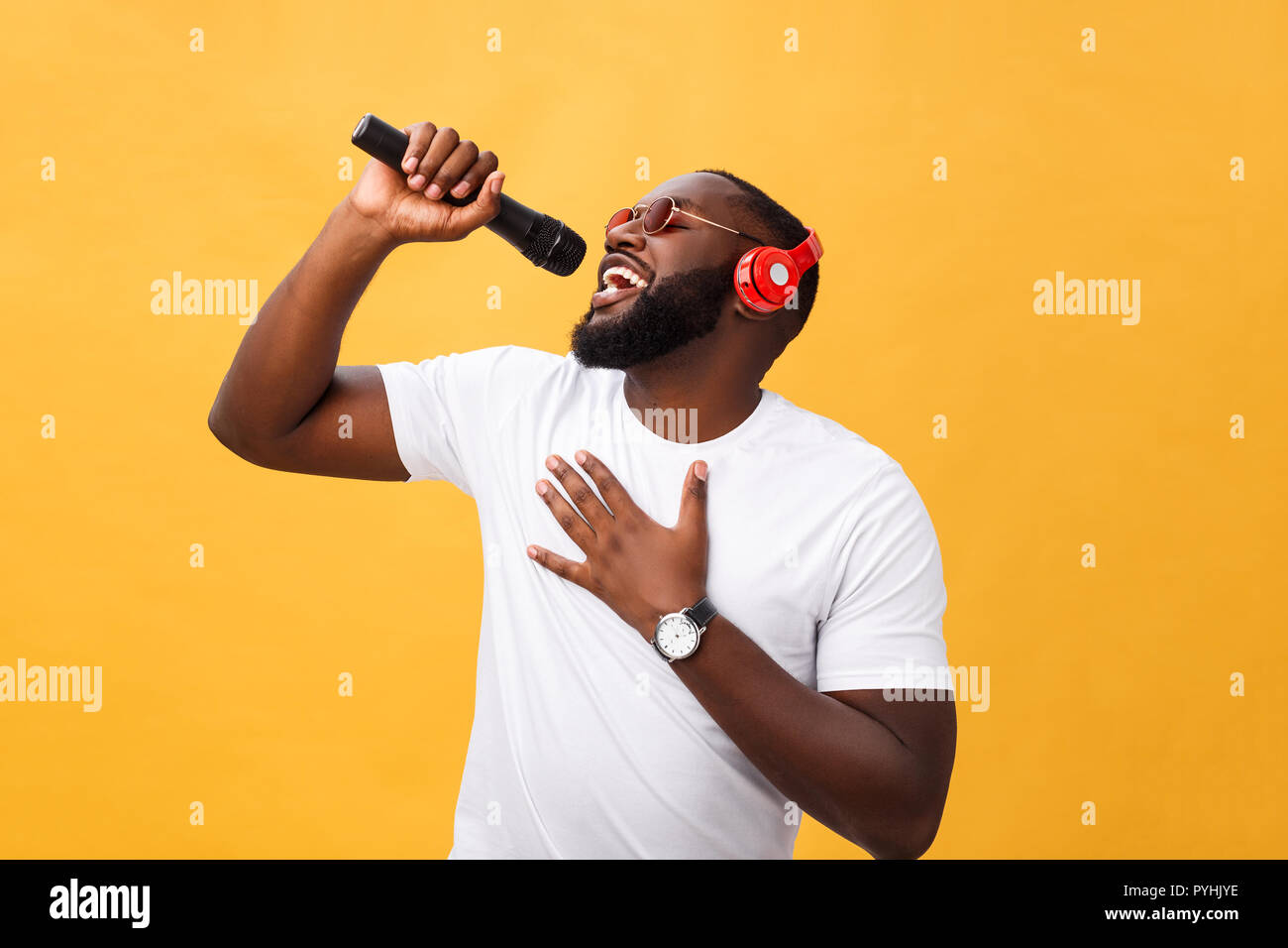 young handsome african american boy singing emotional with micro Stock ...