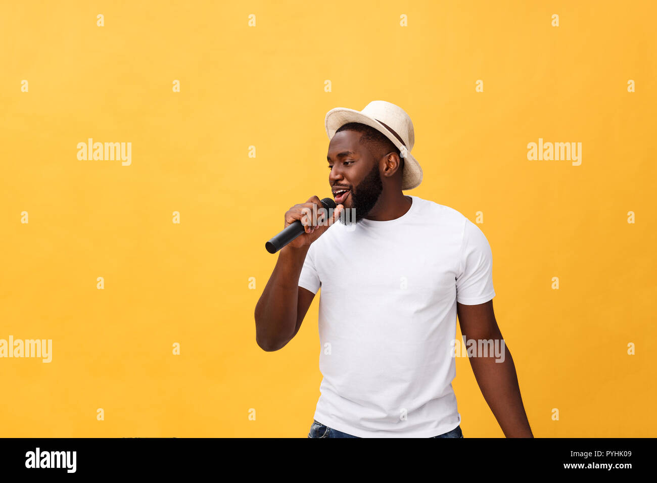 young handsome african american boy singing emotional with microphone ...