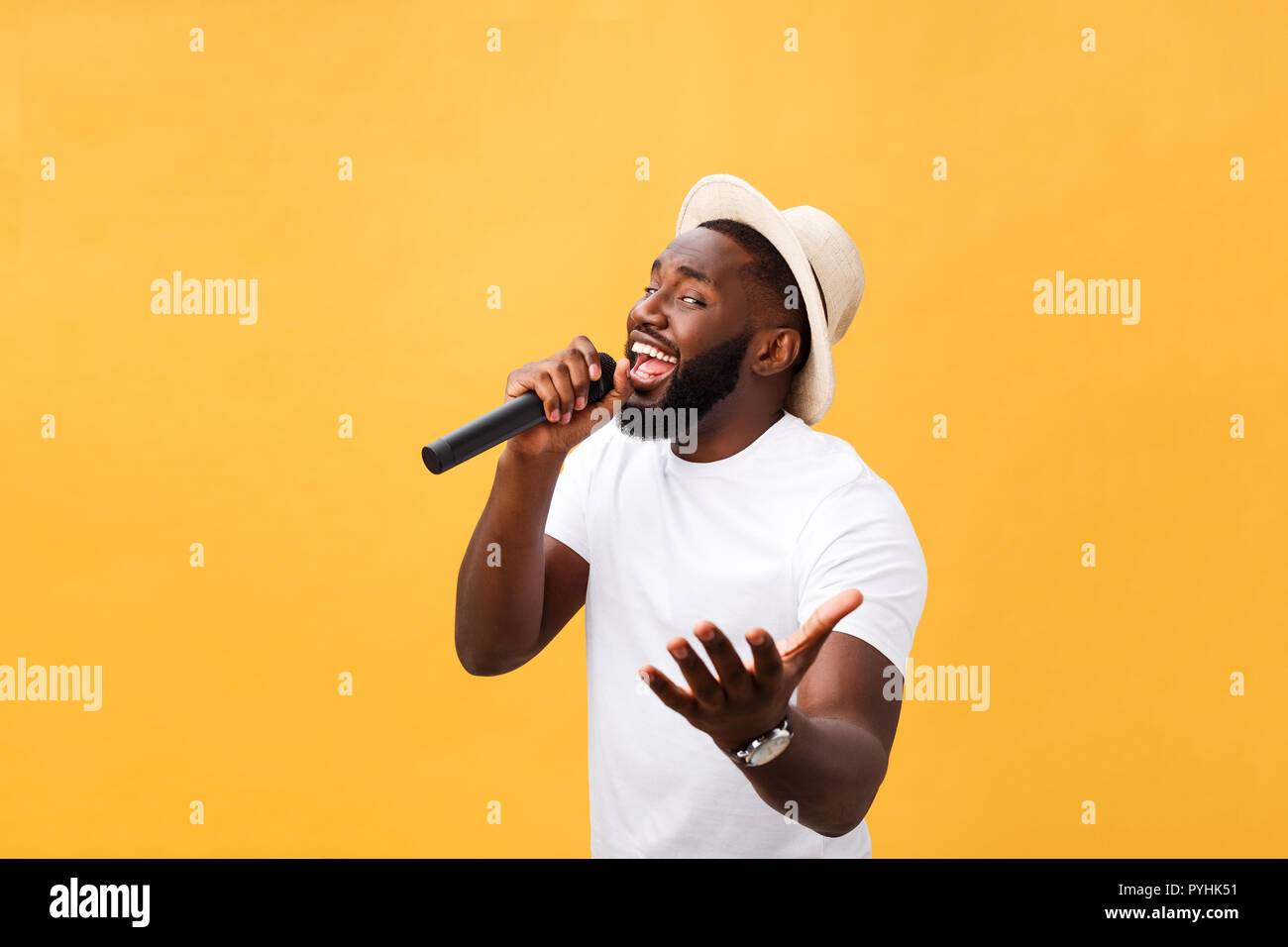 young handsome african american boy singing emotional with microphone ...
