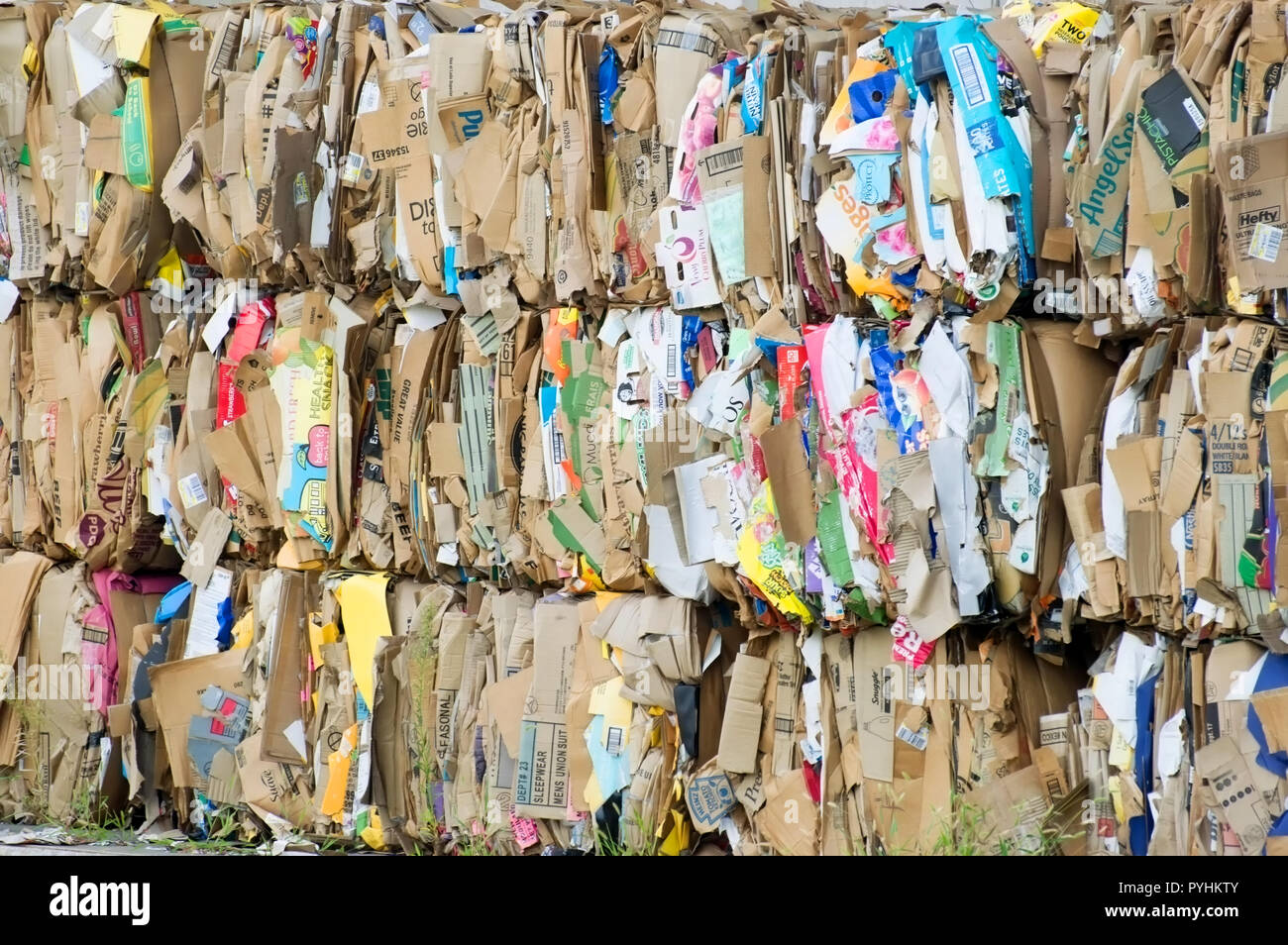 Compressed stacks of recycled carboard and paper Stock Photo - Alamy