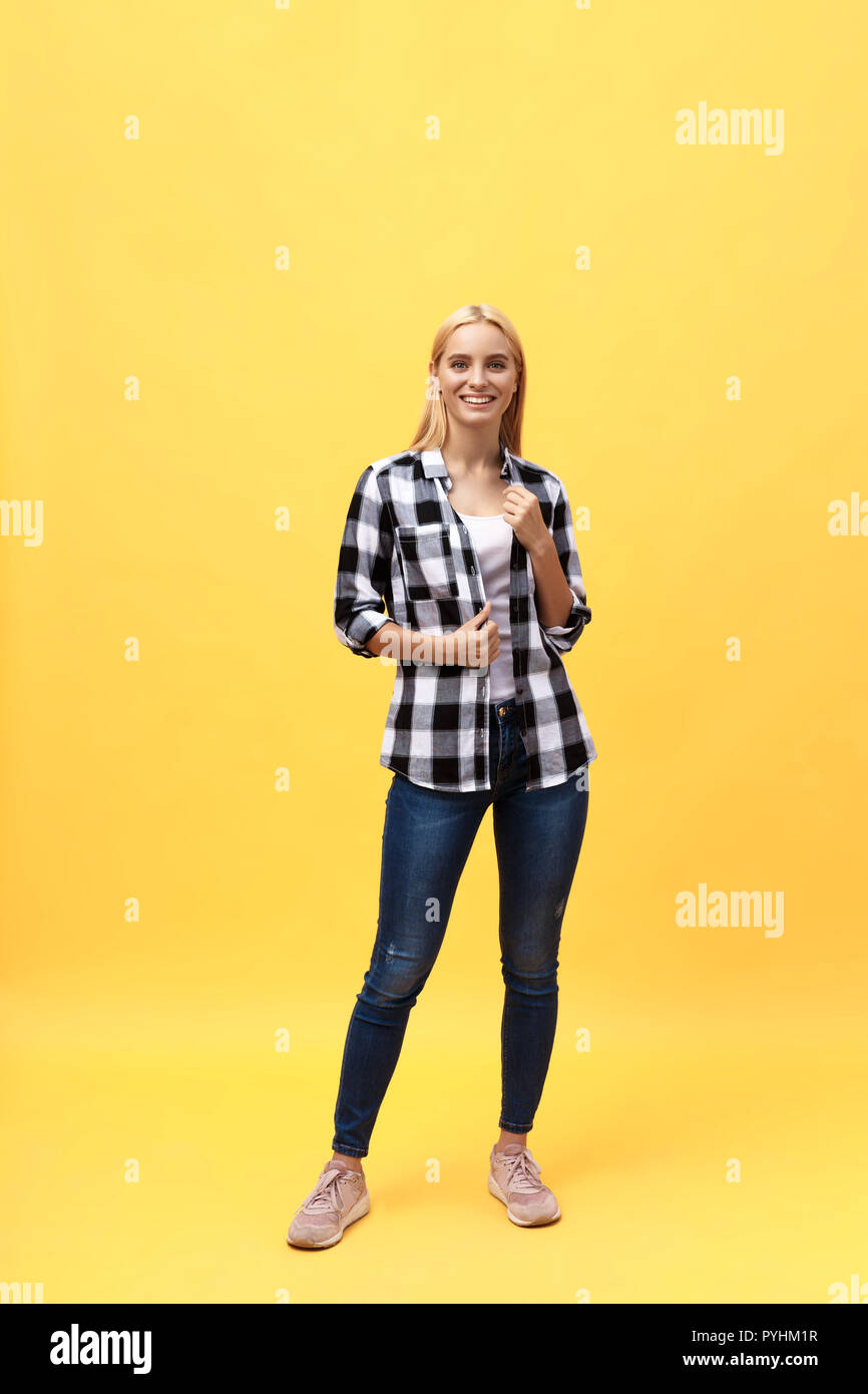 Full length laughing model in studio. looking at camera. isolated ...