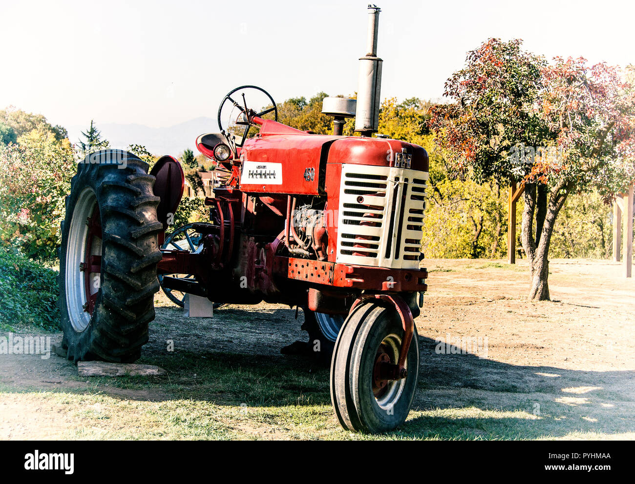 A parked, red tractor; Oak Glen, California, U.S.A Stock Photo - Alamy