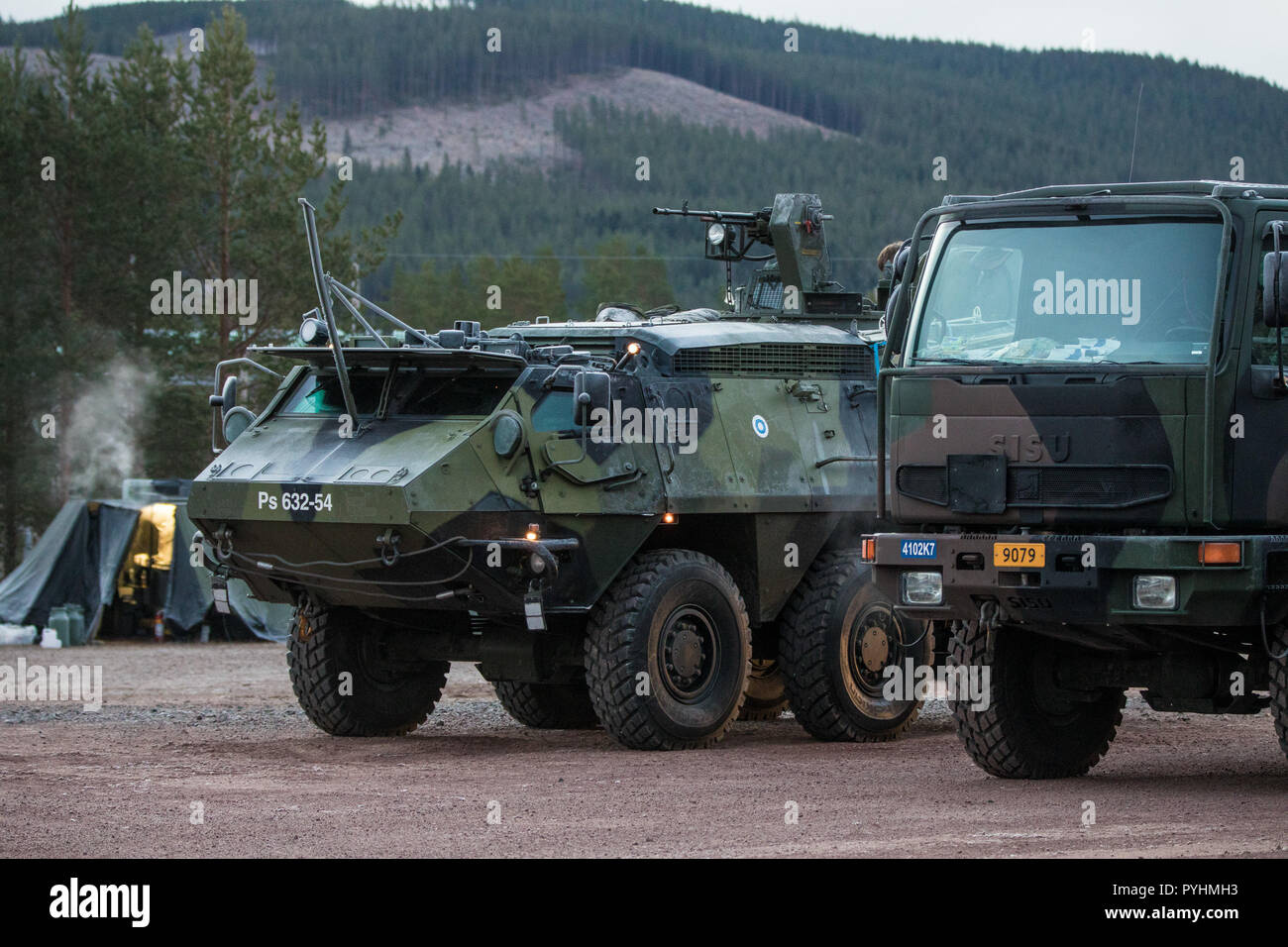 Dawn is breaking as the XA-203 armoured personnel carriers of the ...