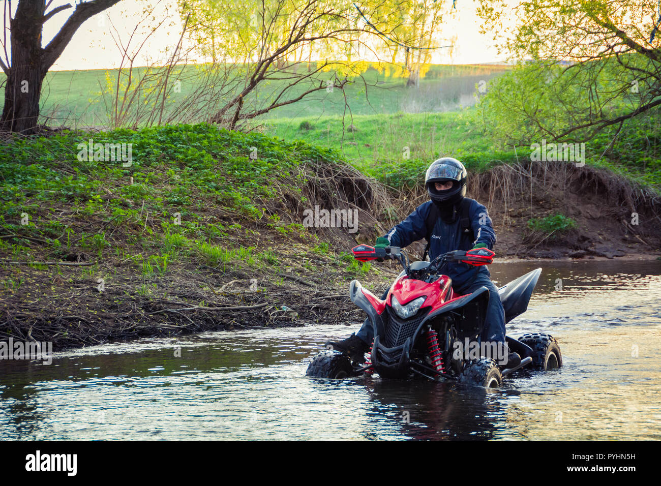 Moscow, Russia - May 17, 2014: ATV Rider in the action on Honda ...