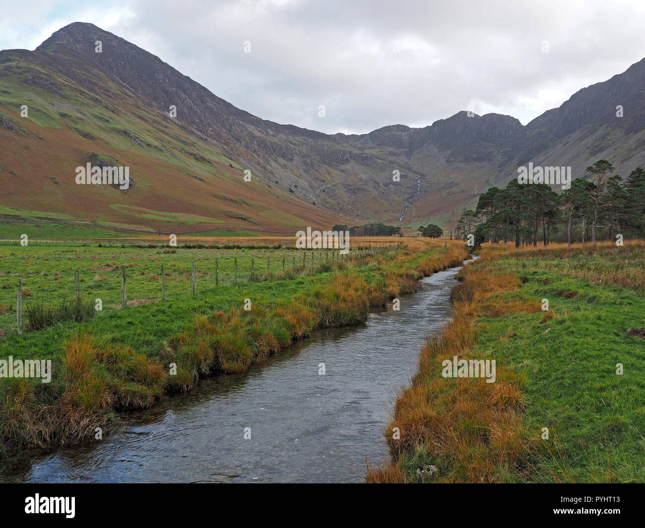 Landscape with stream flowing from Buttermere Fells and Fleetwith Pike ...