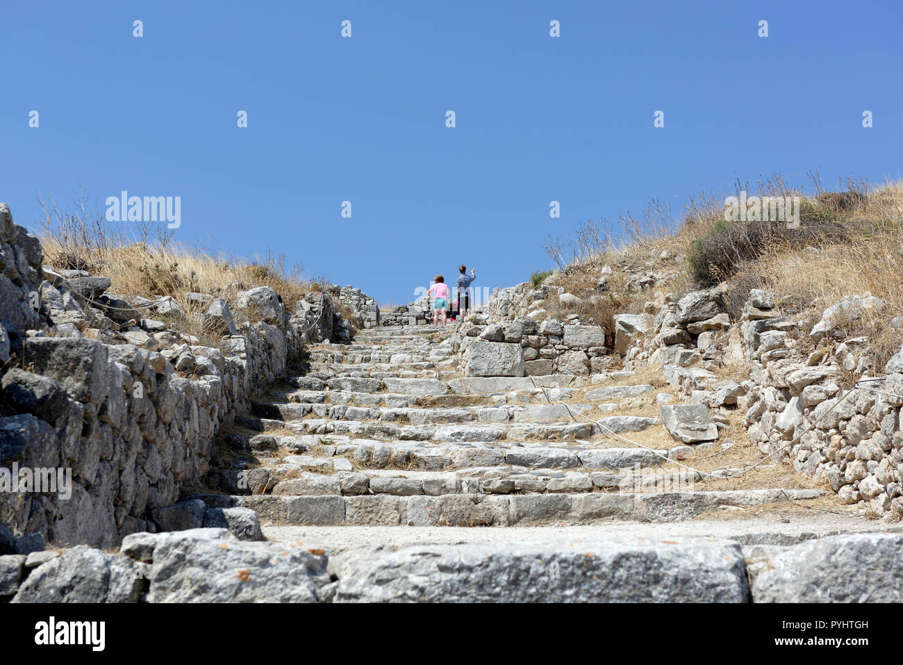 Wide stone-paved stepped street leads to the entrance to the Ptolemaic ...
