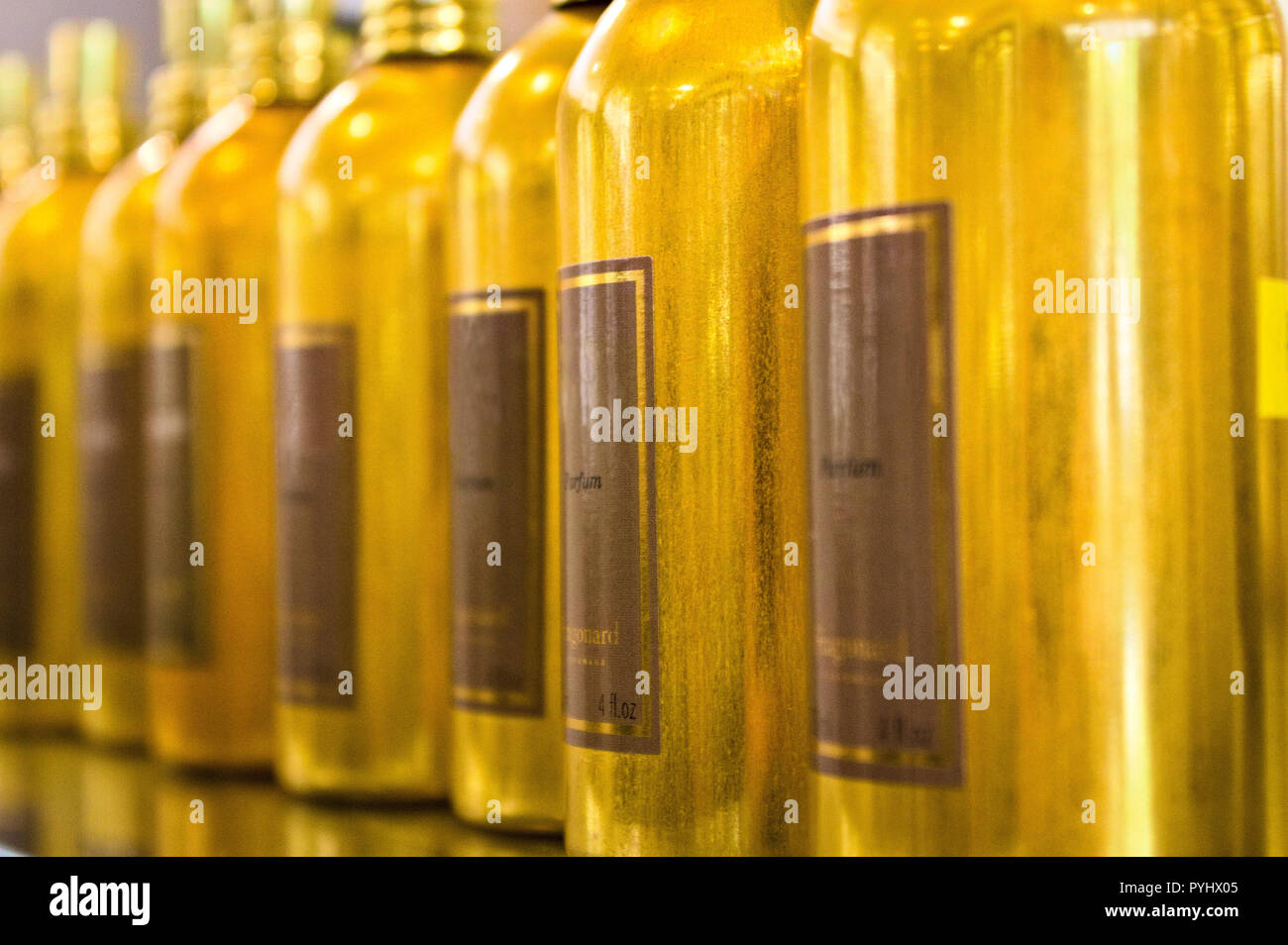 A row of golden bottles Stock Photo - Alamy
