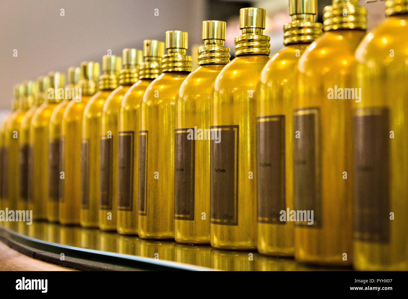 A row of golden bottles Stock Photo - Alamy