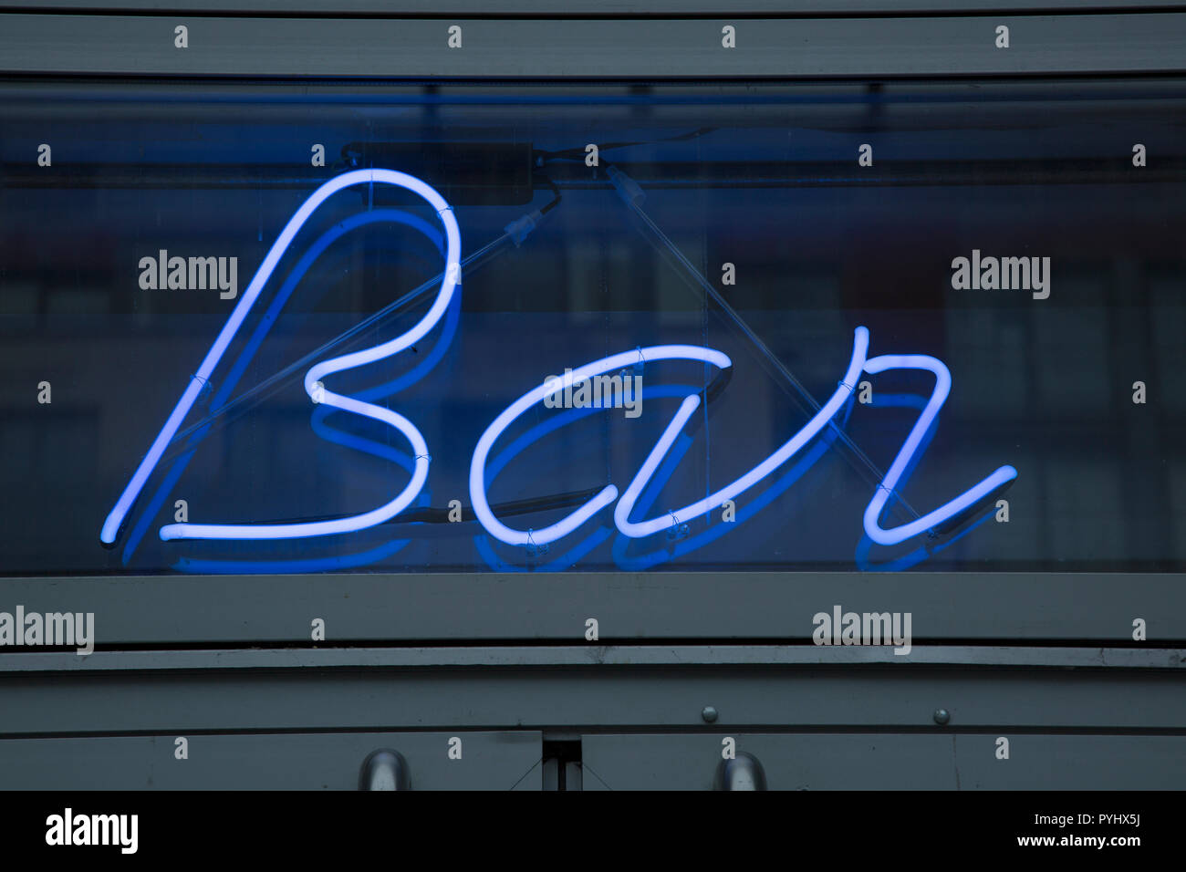Illuminated Bar Sign at Night Stock Photo - Alamy