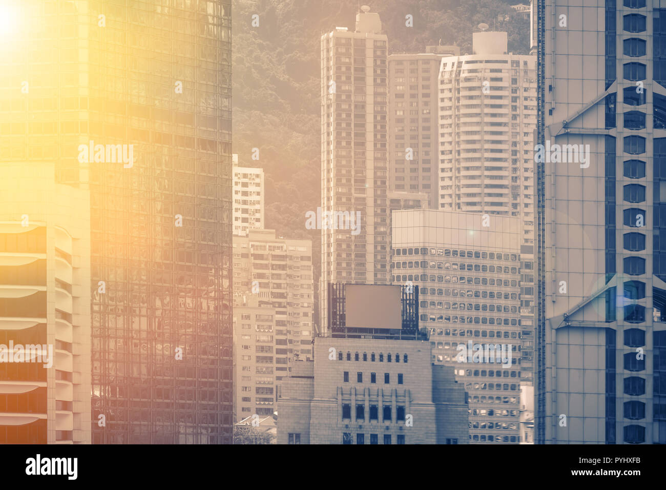 Hong Kong Cityscraper with sun ray Stock Photo - Alamy