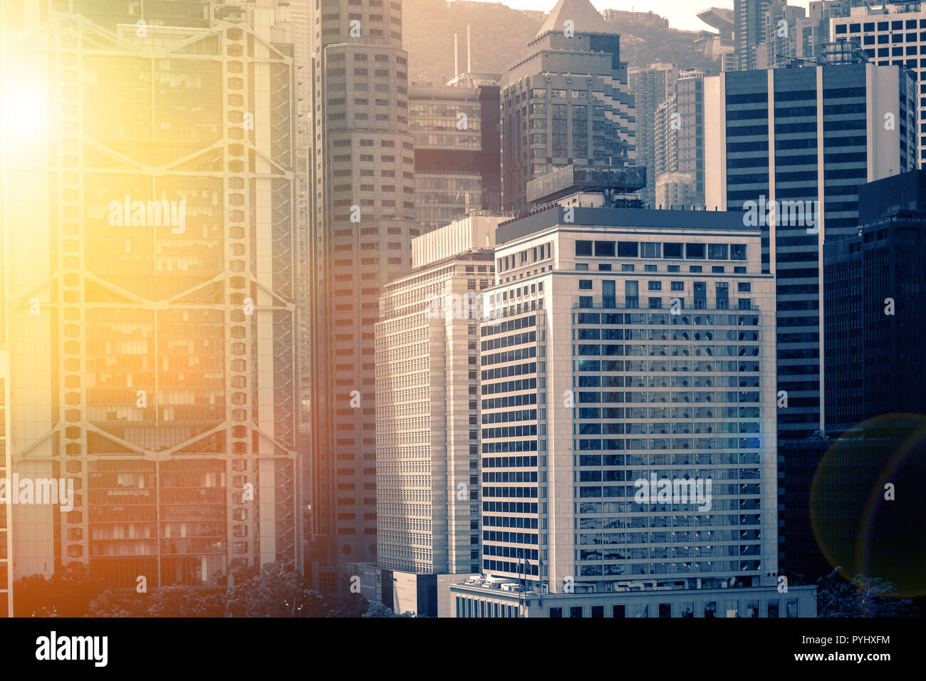 Hong Kong Cityscraper with sun ray Stock Photo - Alamy