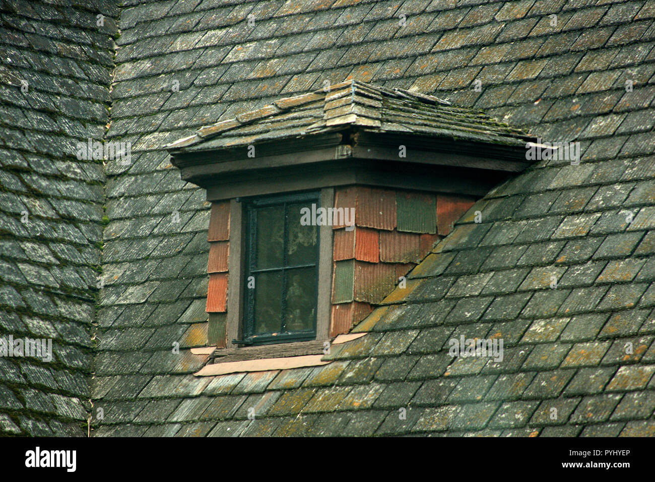 Close-up of small attic window and roof Stock Photo - Alamy