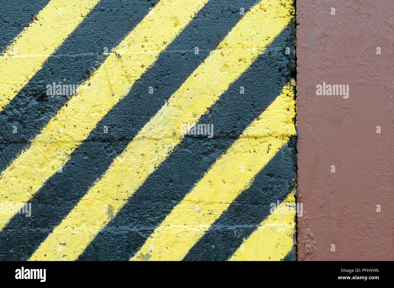 Black and yellow striped markings as a danger warning Stock Photo - Alamy