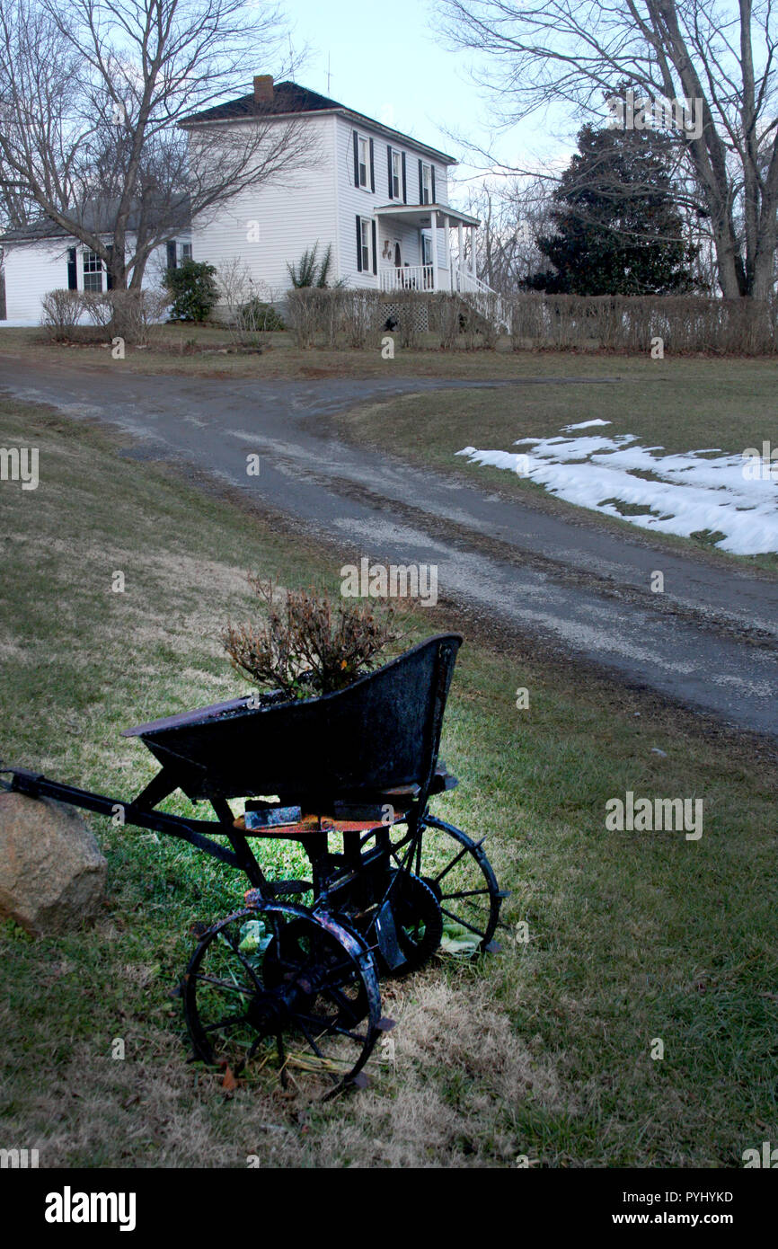 Old wheelbarrow used as yard decor in rural Virginia, USA Stock Photo ...