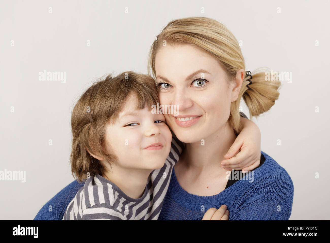 Mum hugging son hi-res stock photography and images - Alamy