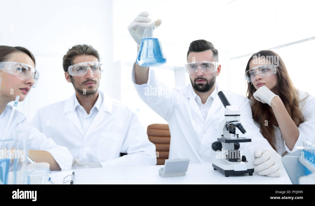 Team of scientists working together at the laboratory Stock Photo - Alamy