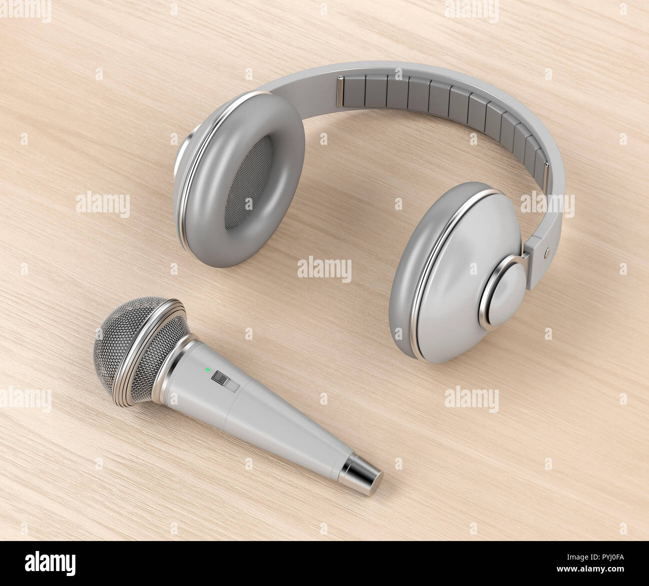 Grey wireless microphone and headphones on wood background Stock Photo ...