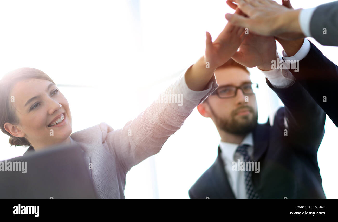happy business team giving high five in office Stock Photo - Alamy