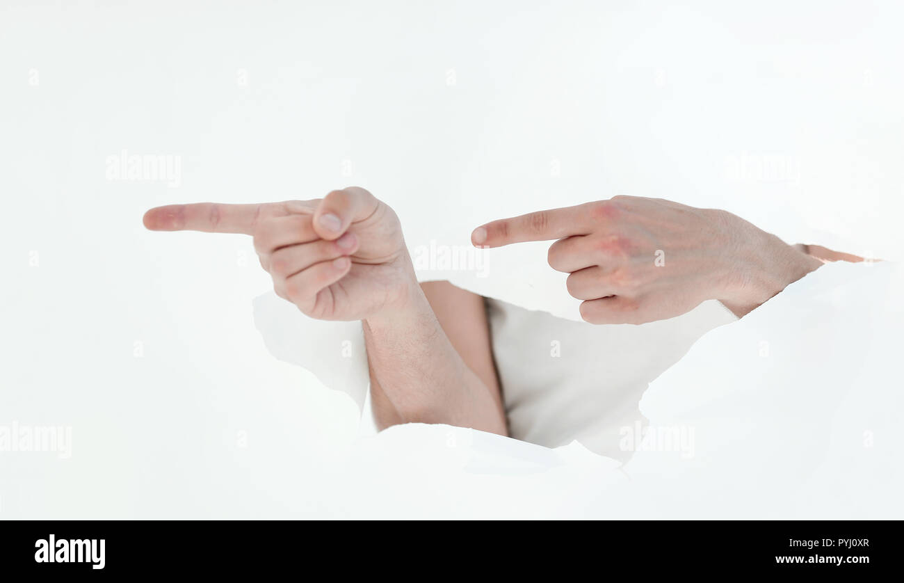 close up.a man is breaking through a paper wall Stock Photo - Alamy