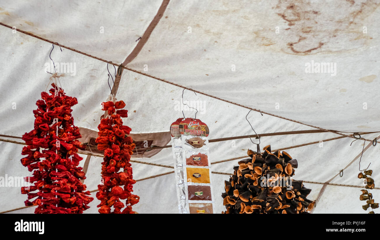 Strings of Chilli hanging above market stall Stock Photo - Alamy