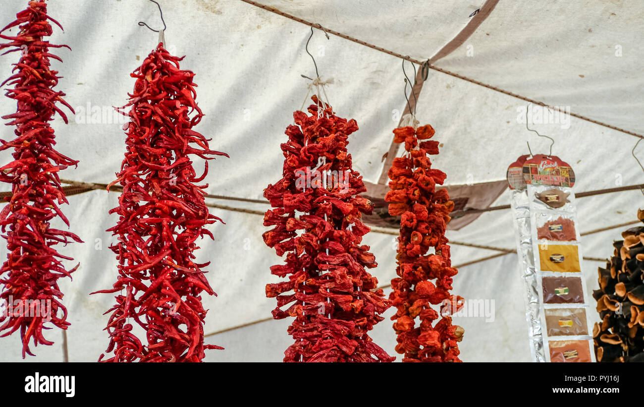 Bright Red Sun Dried Tomatoes and Chillies above market Stall Stock ...