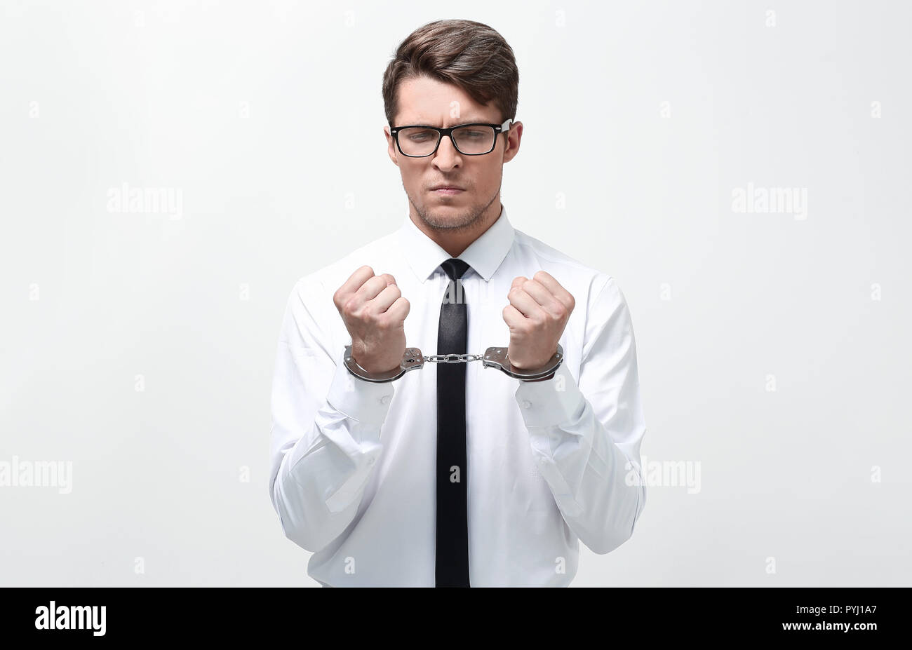 Young man in handcuffs hi-res stock photography and images - Alamy