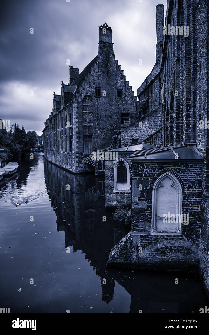 Medieval channels of Bruges, detail of tourism in a city of Belgium ...