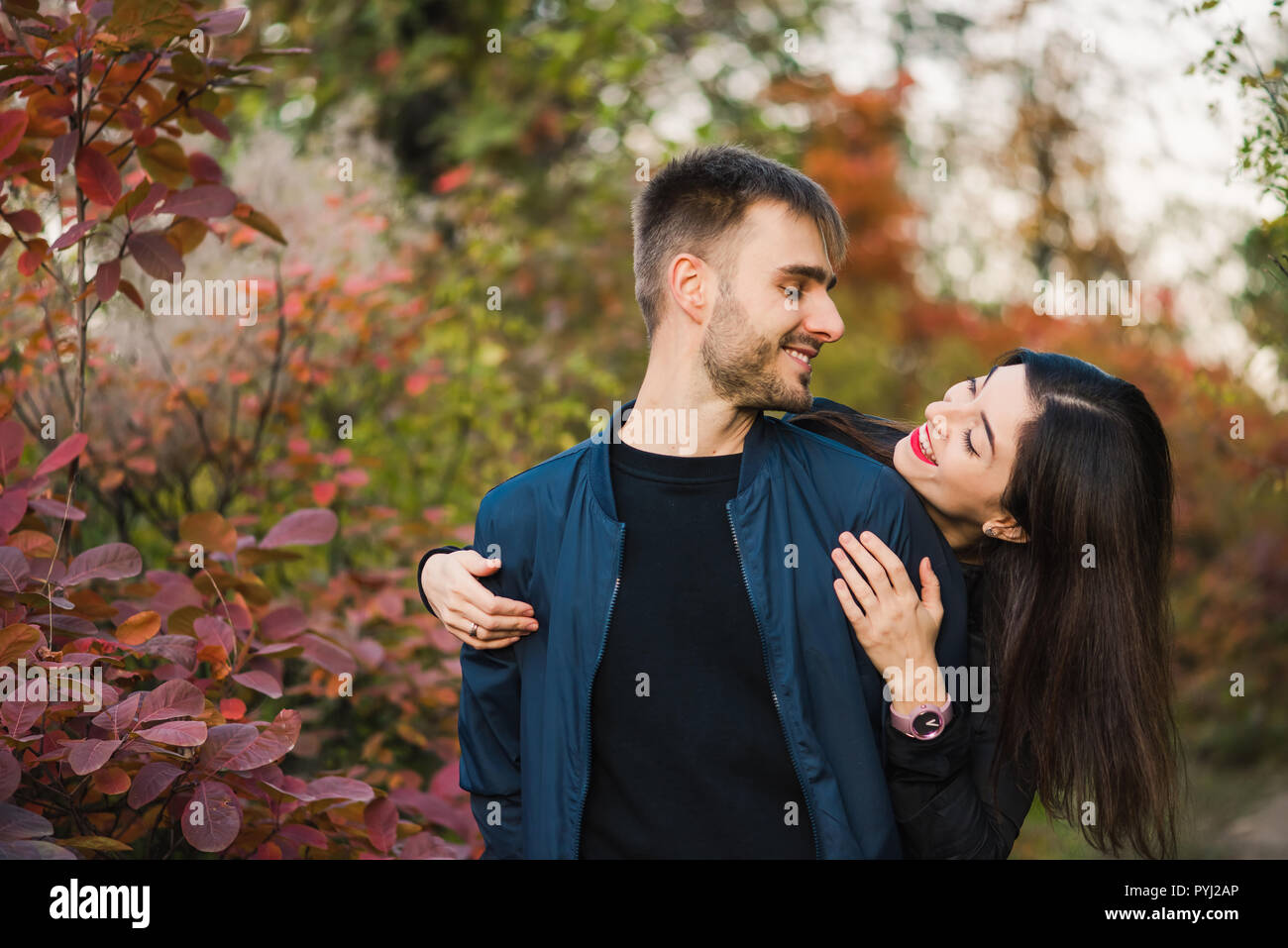 Woman cuddles man hi-res stock photography and images - Alamy