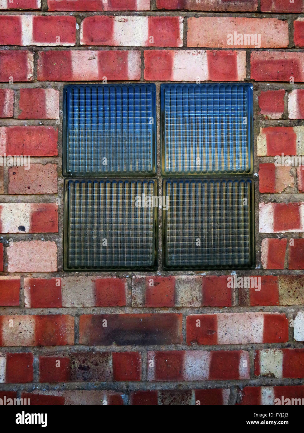 Old Arched window now bricked up and now has 4 square Glass Bricks in ...