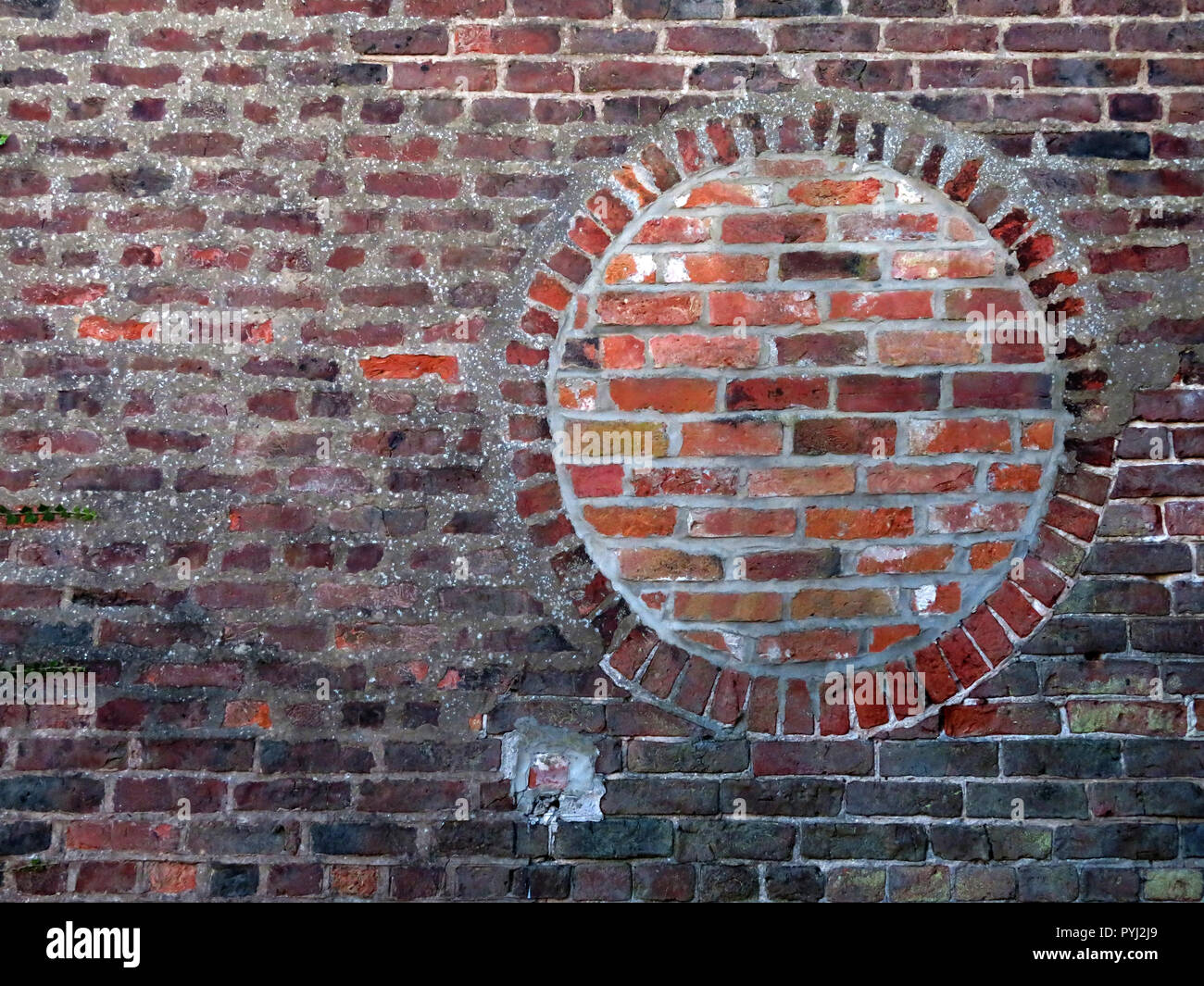 Bricked up round window opening using contrasting red bricks in Bawtry ...