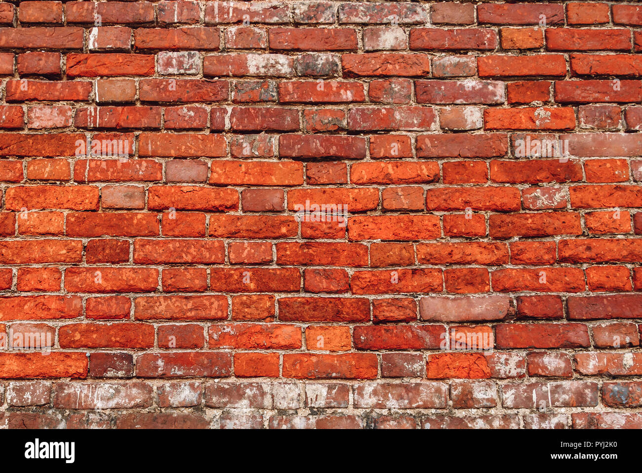 Background of old red chipped brick wall Stock Photo - Alamy