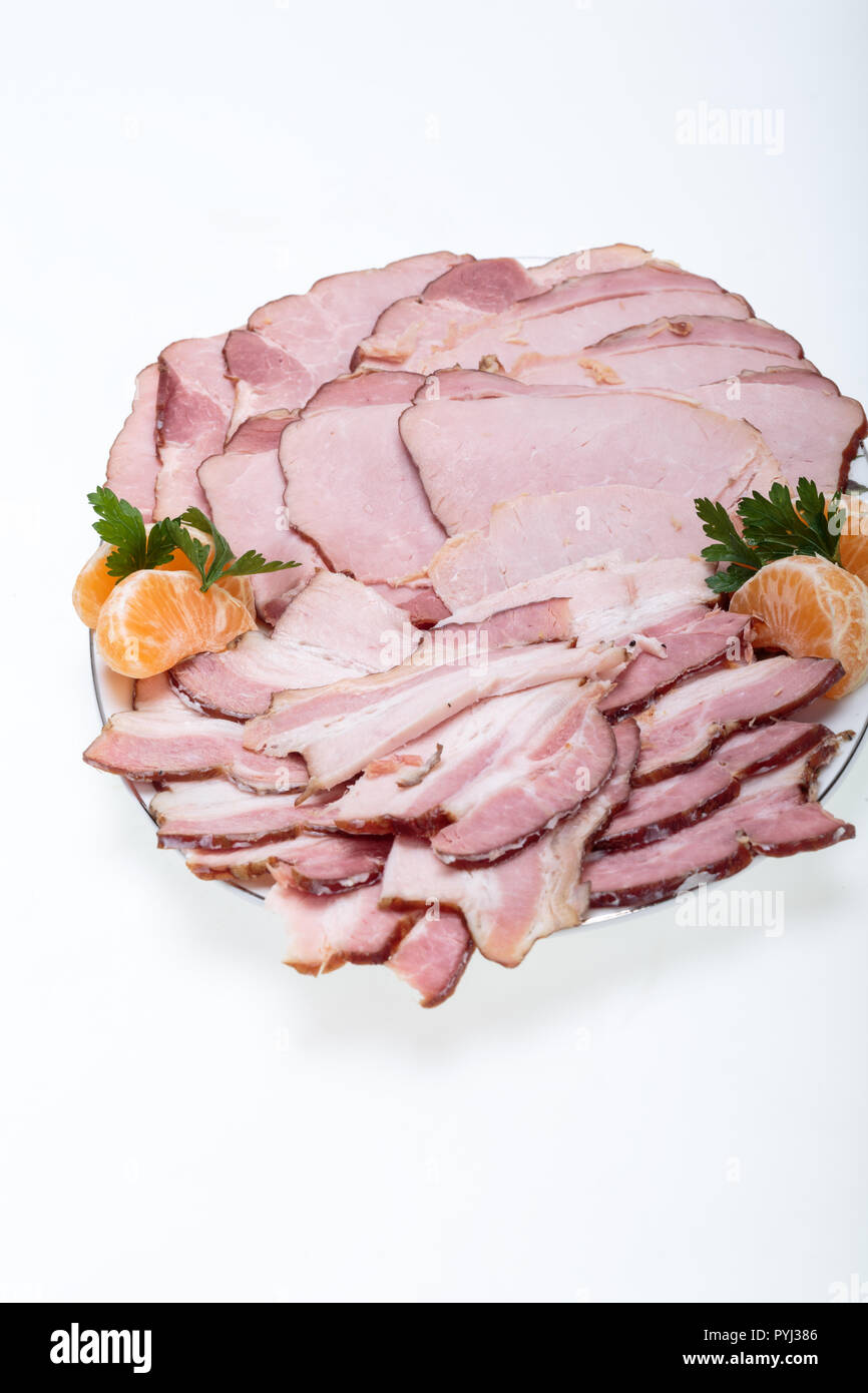 Plate of smoked meat isolated on white background Stock Photo - Alamy